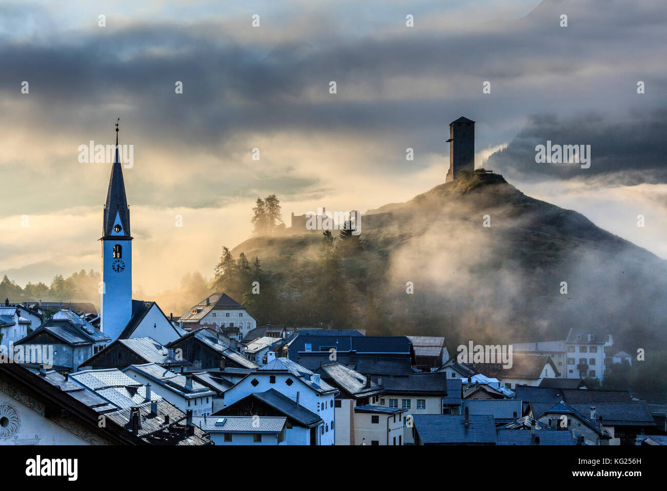 Misty sky on the alpine village of ardez at sunrise hi-res stock ...