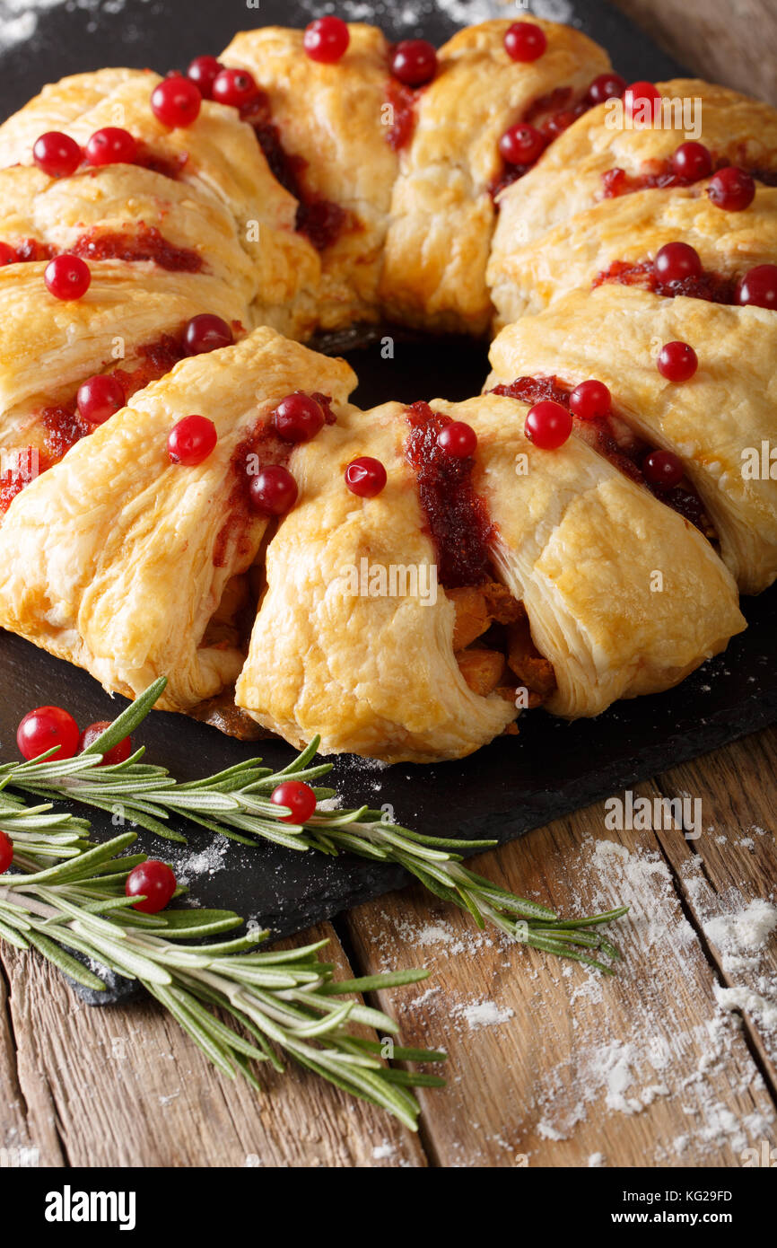 Christmas meat pie with cranberries, rosemary and cheese close-up on ...
