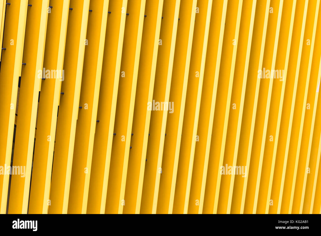 Detail of bright yellow metal building facade. For background Stock ...