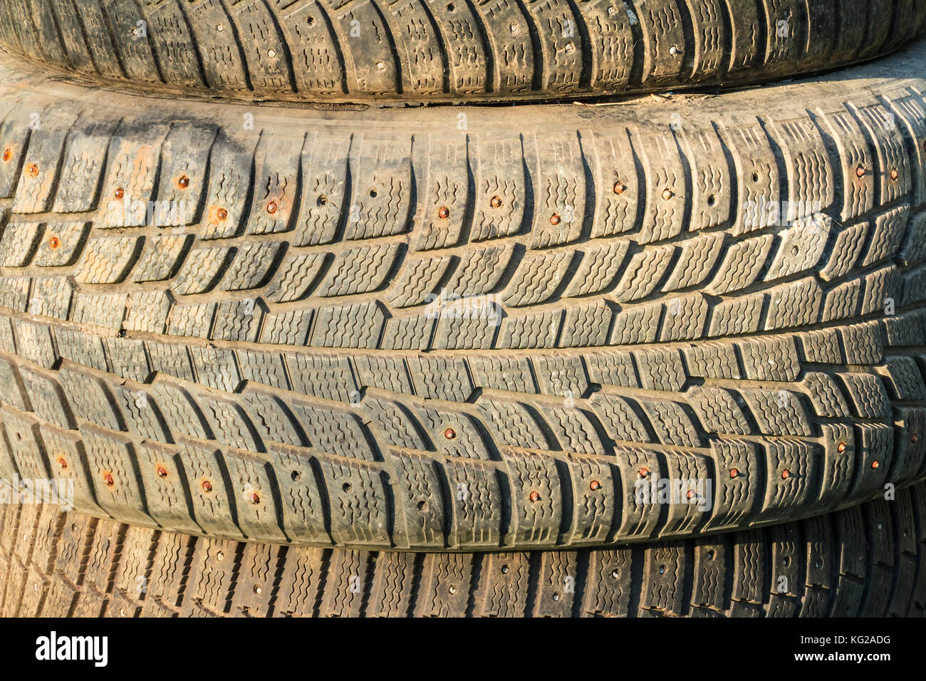 A stack of old tires with textured tread on sunlight closeup Stock ...