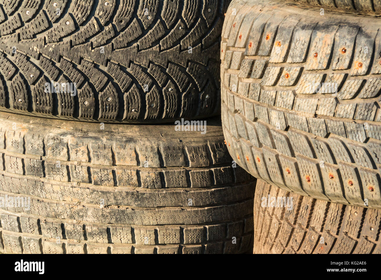 A stack of old tires with textured tread on sunlight closeup Stock ...
