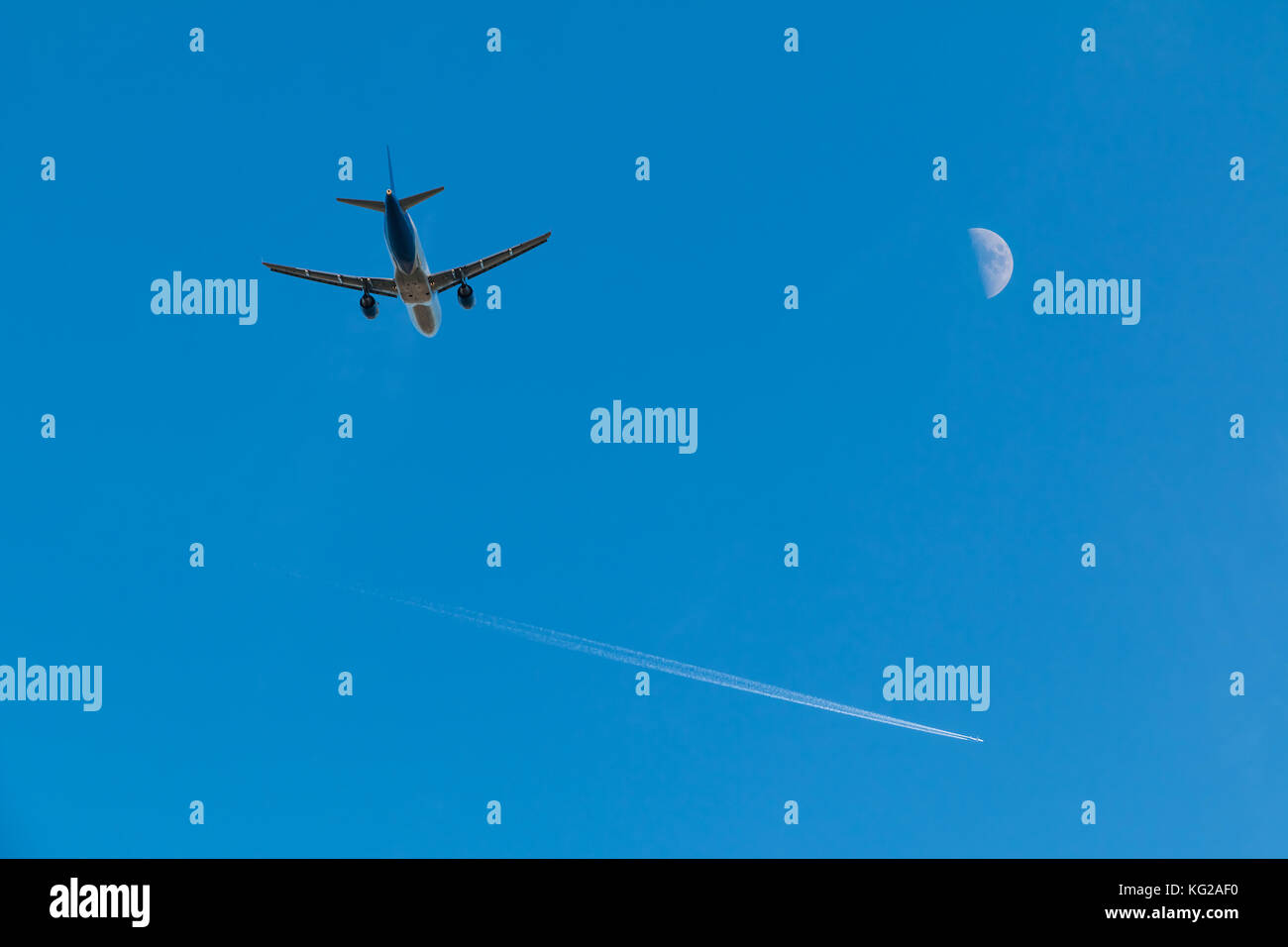 Plane taking off, plane high in the sky and moon Stock Photo - Alamy