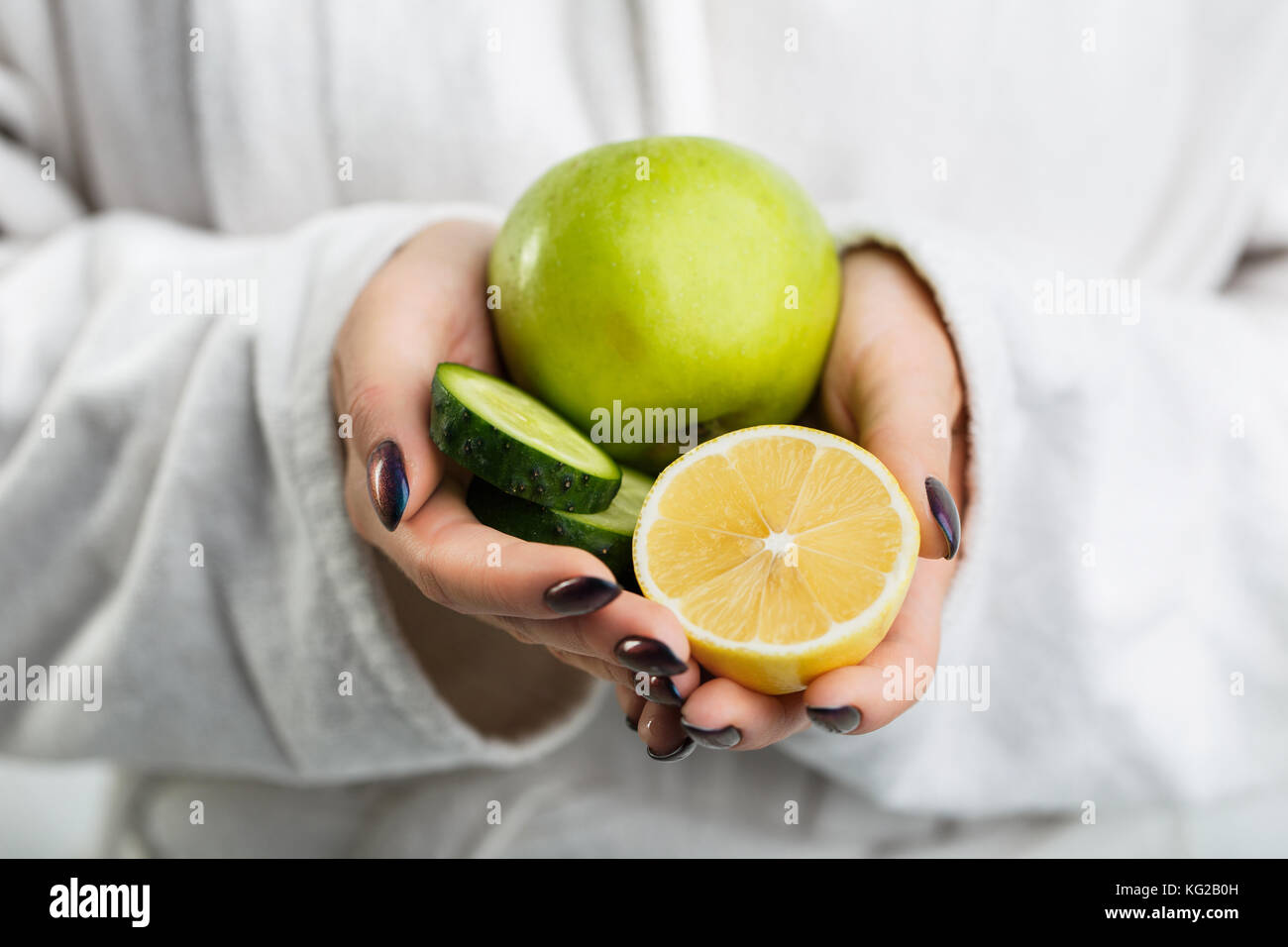 Fresh Fruits in Hands Stock Photo - Alamy