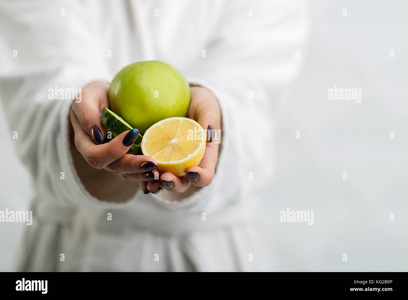 Fresh Fruits in Hands Stock Photo - Alamy