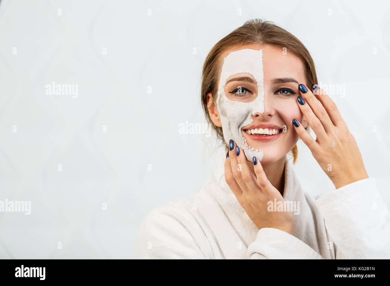 Smiling Girl Applies Face Mask Stock Photo - Alamy