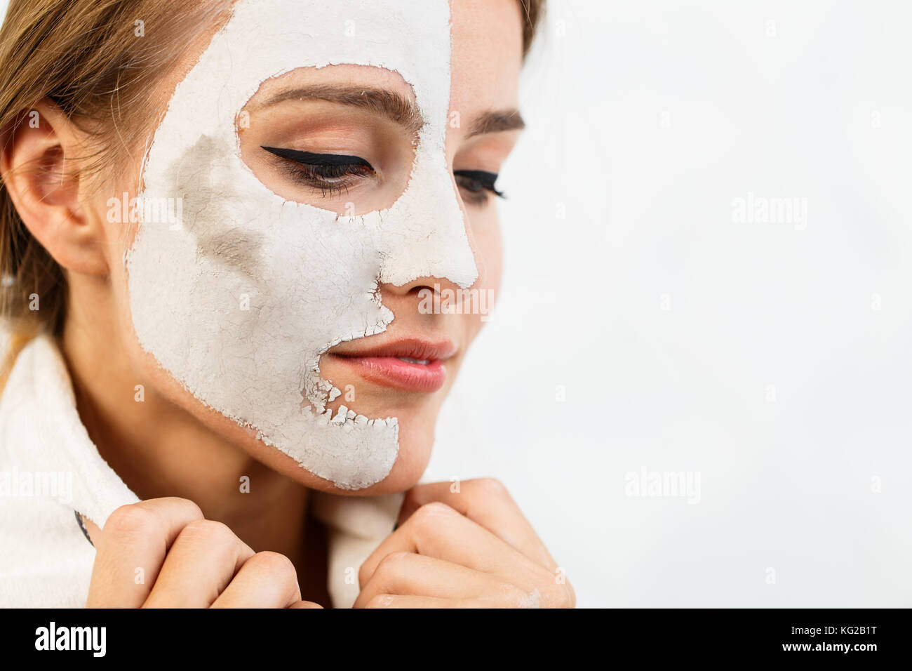Smiling Girl Applies Face Mask Stock Photo - Alamy