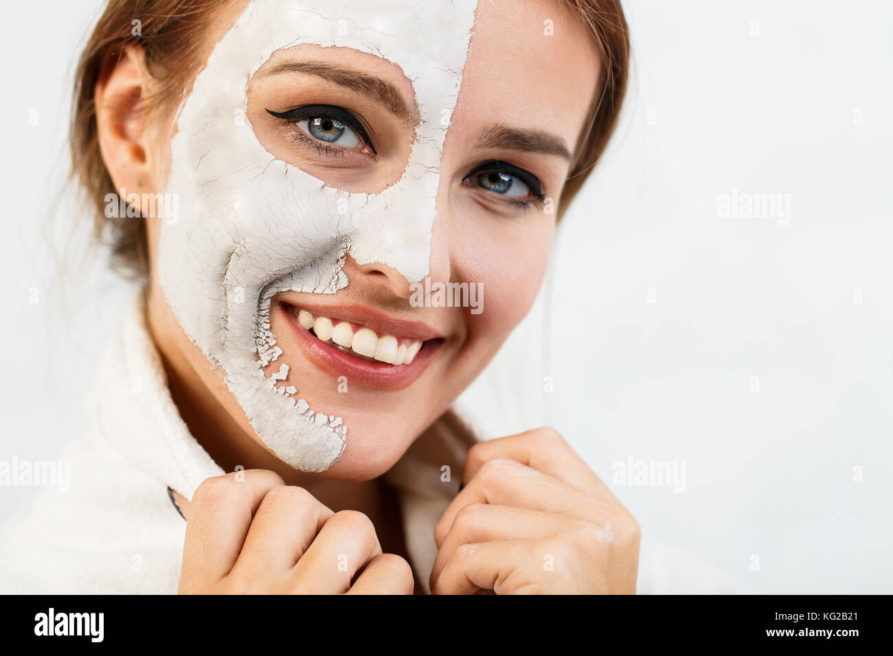 Smiling Girl Applies Face Mask Stock Photo - Alamy