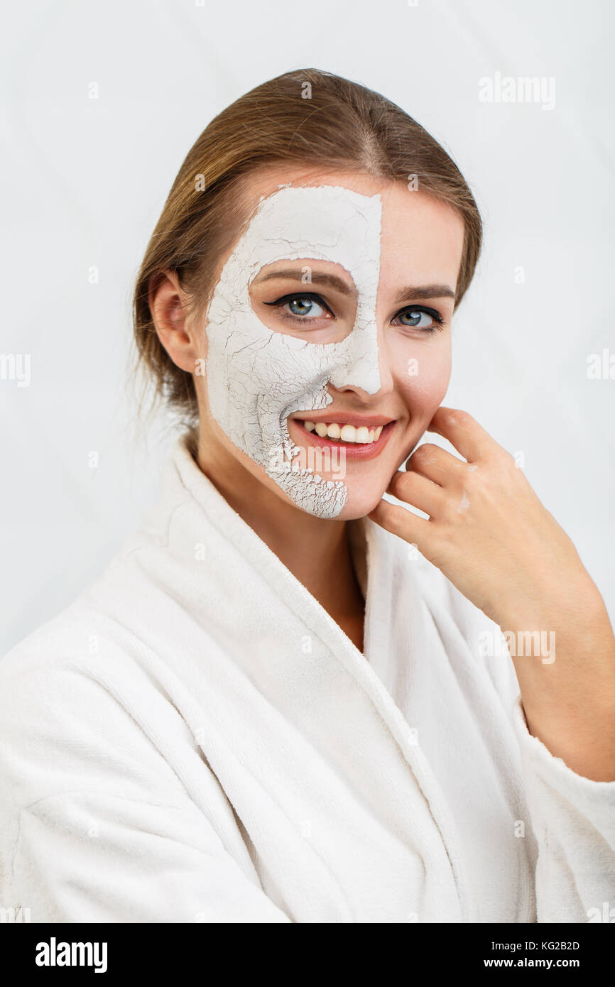 Smiling Girl Applies Face Mask Stock Photo - Alamy