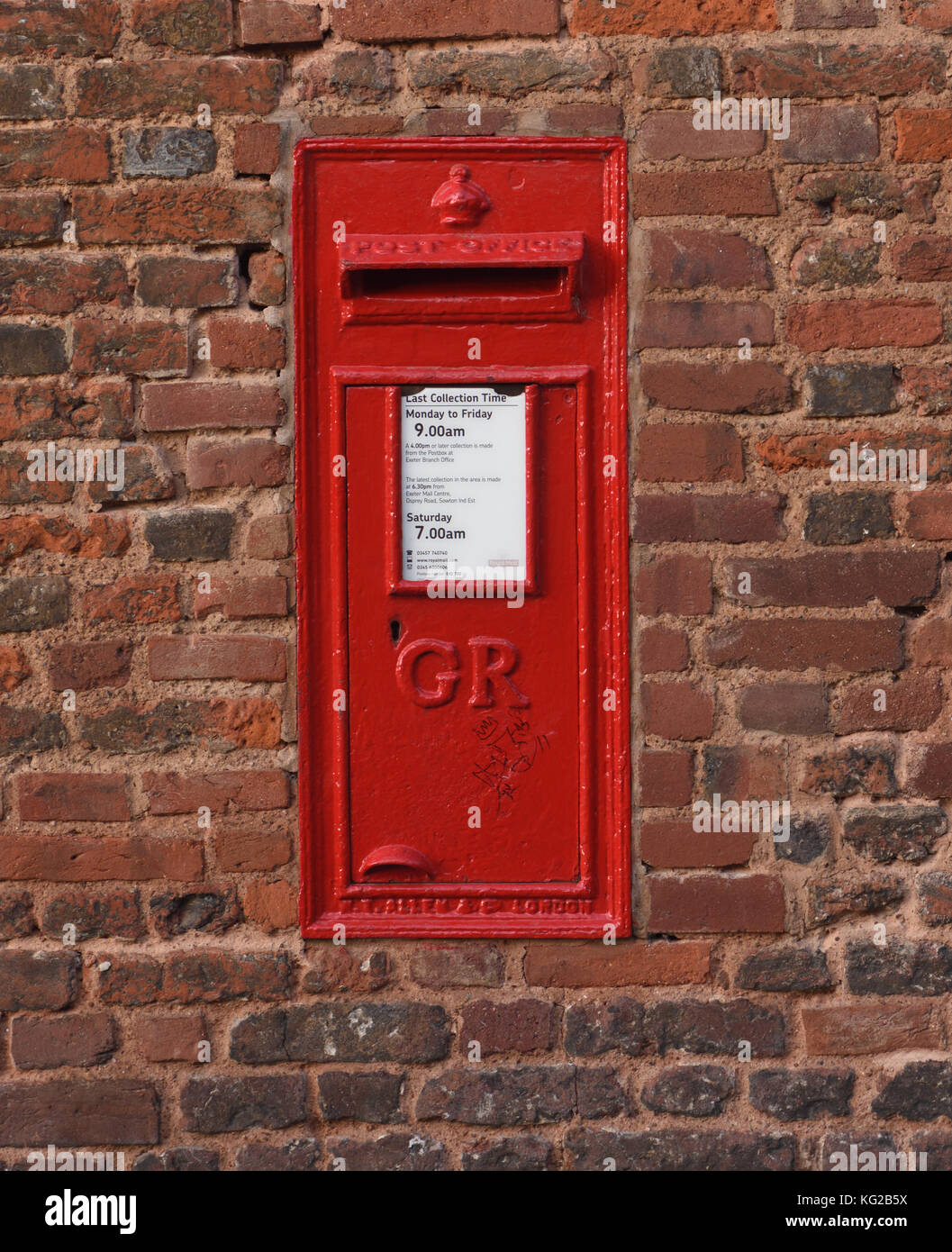 A red GR letter box set in an old brick wall. Exeter, Devon, UK Stock ...