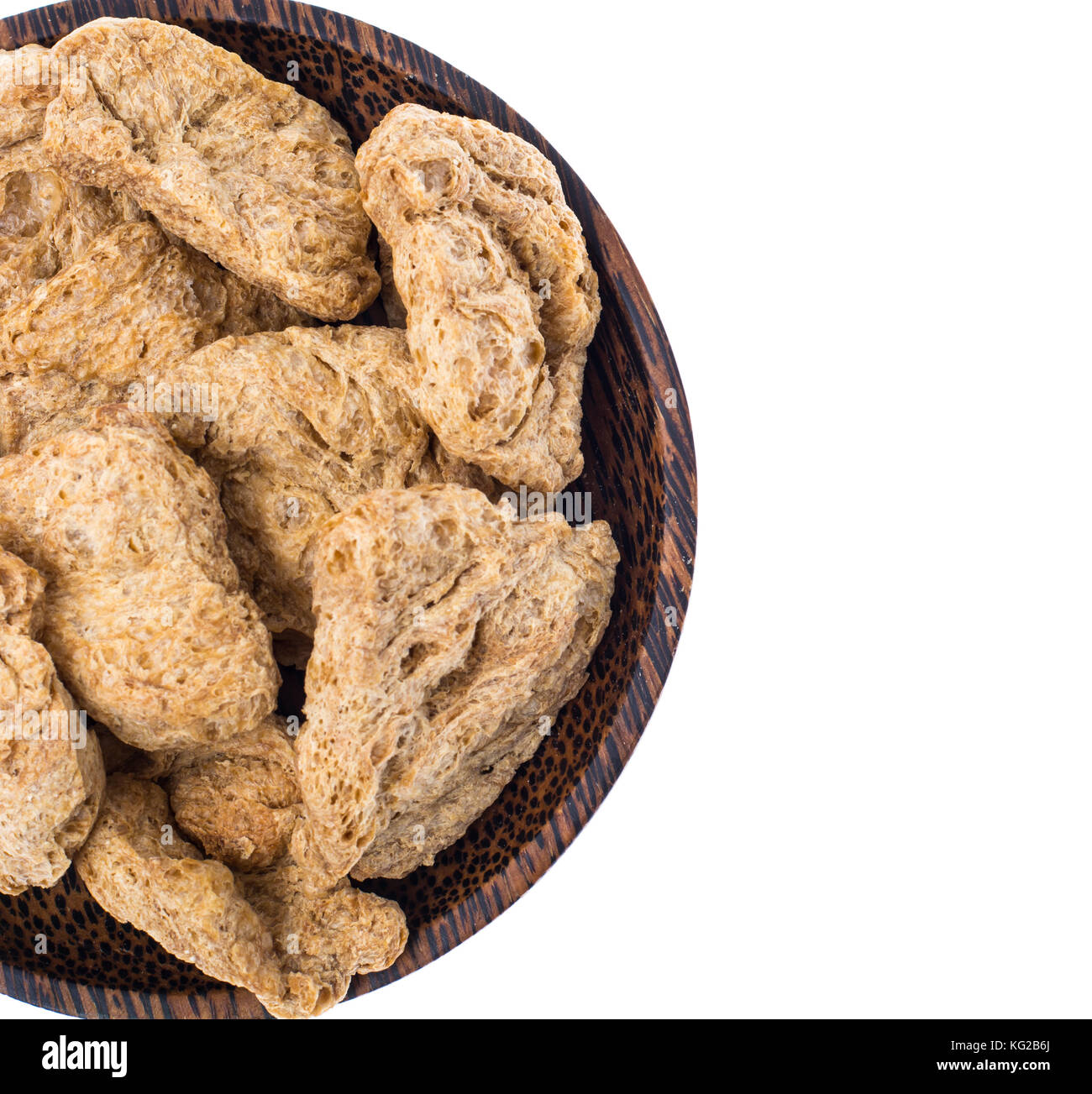 Dry soy slices of meat in wooden plate on white background. Studio ...