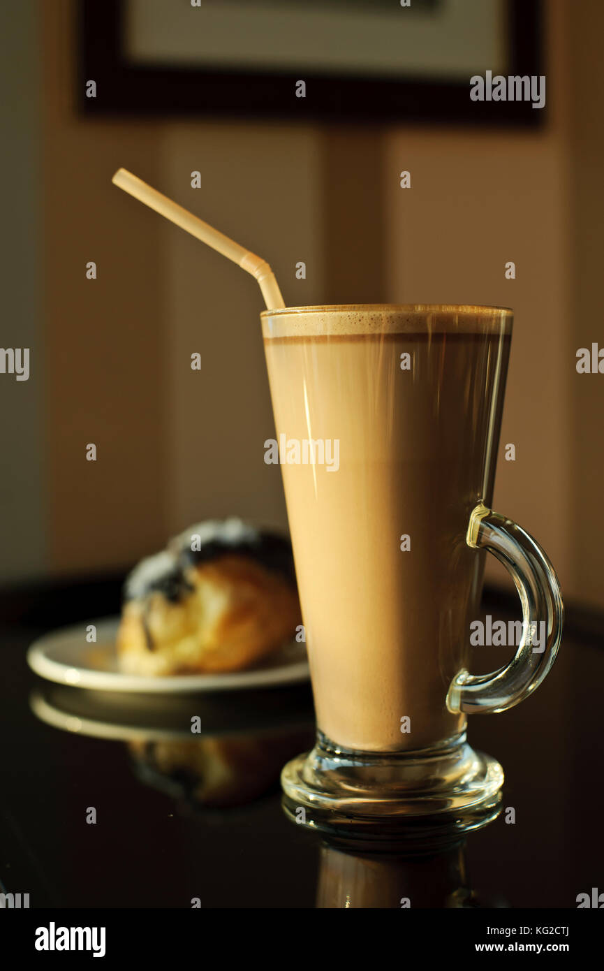 Cup of hot cocoa with straw to drink on a dark background Stock Photo ...