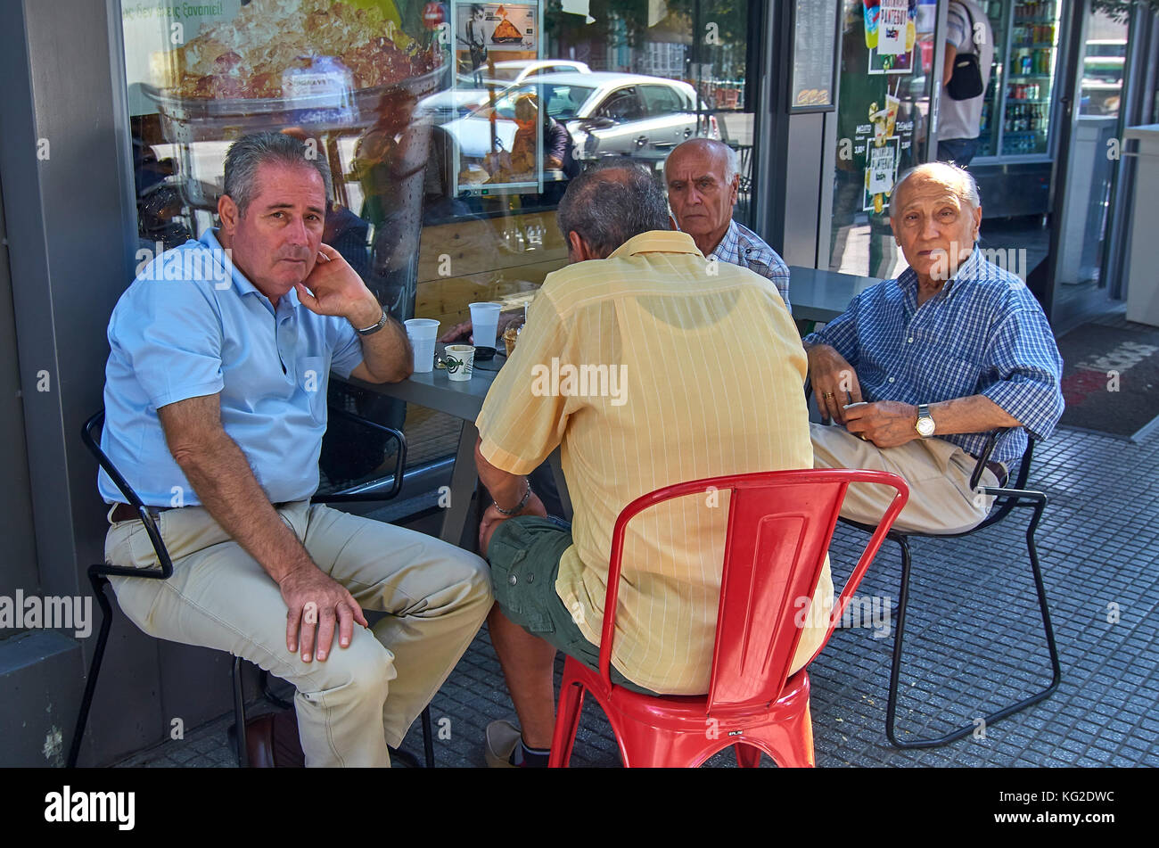 Greek old men sitting at a table Stock Photo - Alamy
