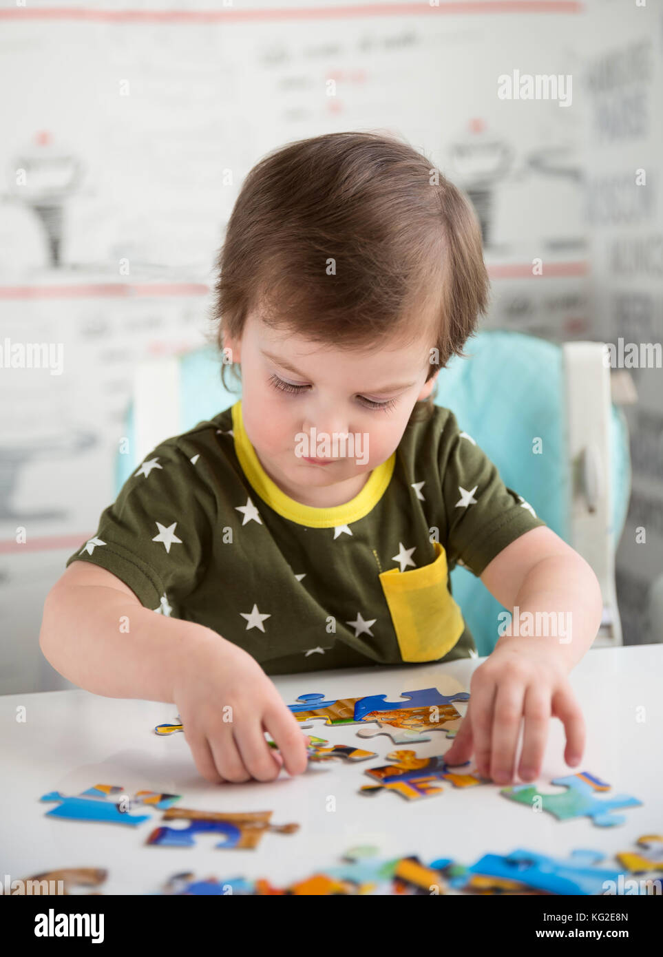 Little baby boy or toddler playing with a puzzle, child development ...