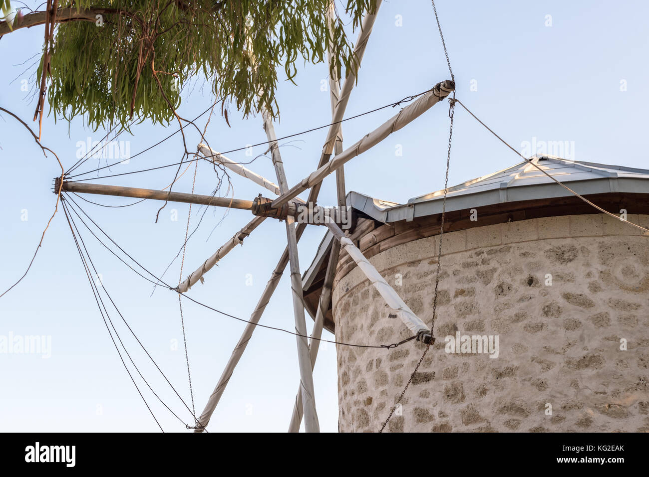 Close detailed view of ancient stone windmill on clean blue sky ...