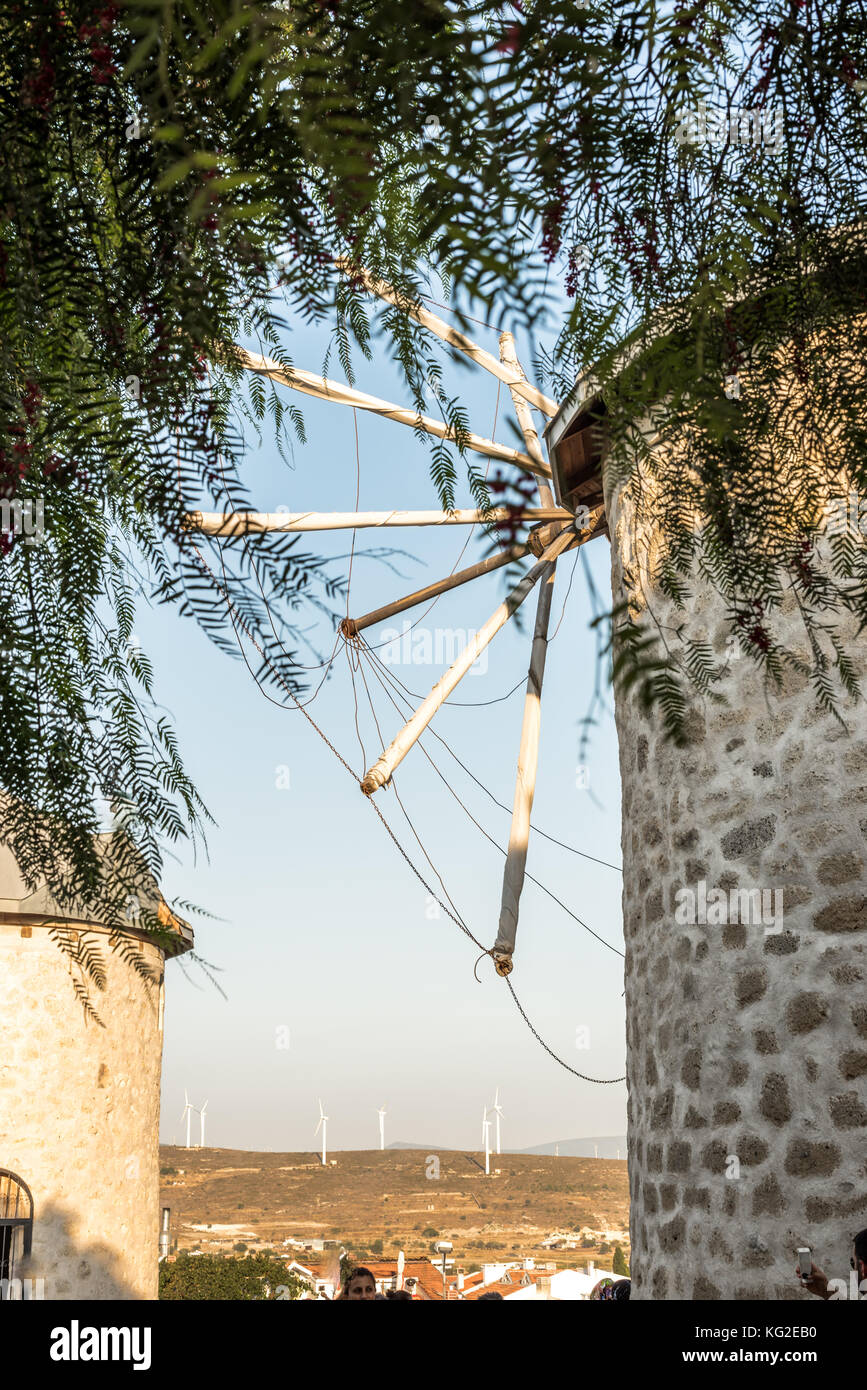 Close detailed view of ancient stone windmill on clean blue sky ...