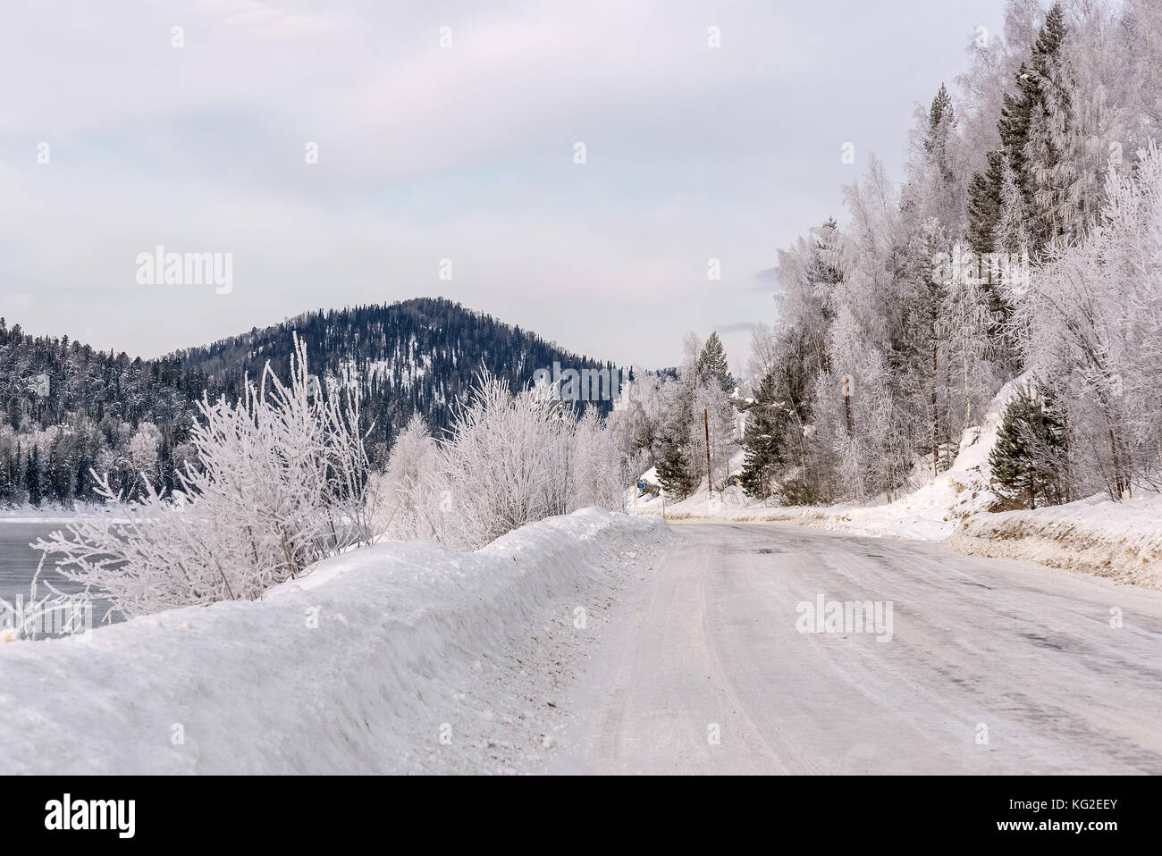 Scenic winter view from the asphalt road, covered with snow and ...