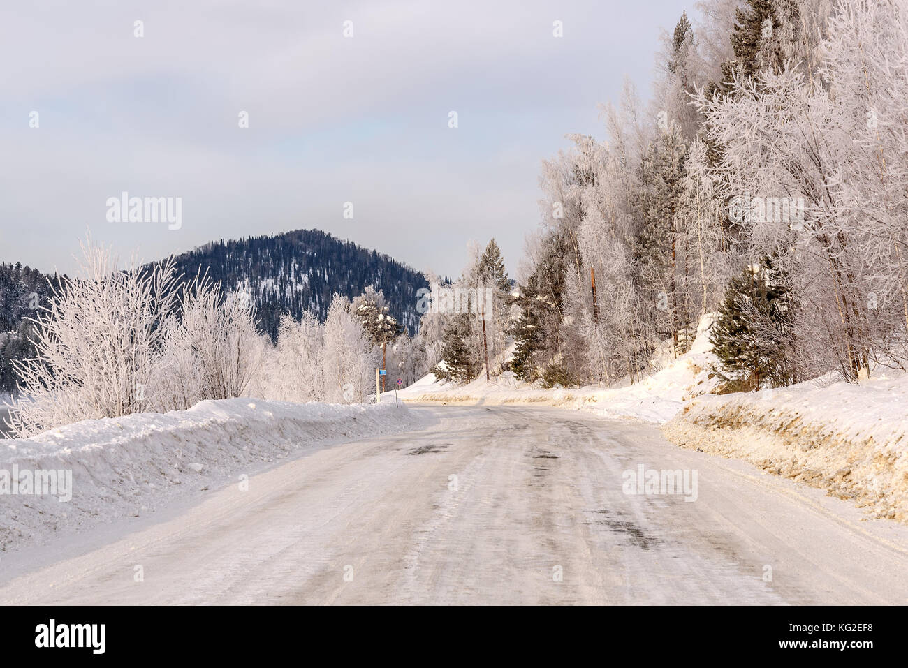 Scenic winter view from the asphalt road, covered with snow and ...
