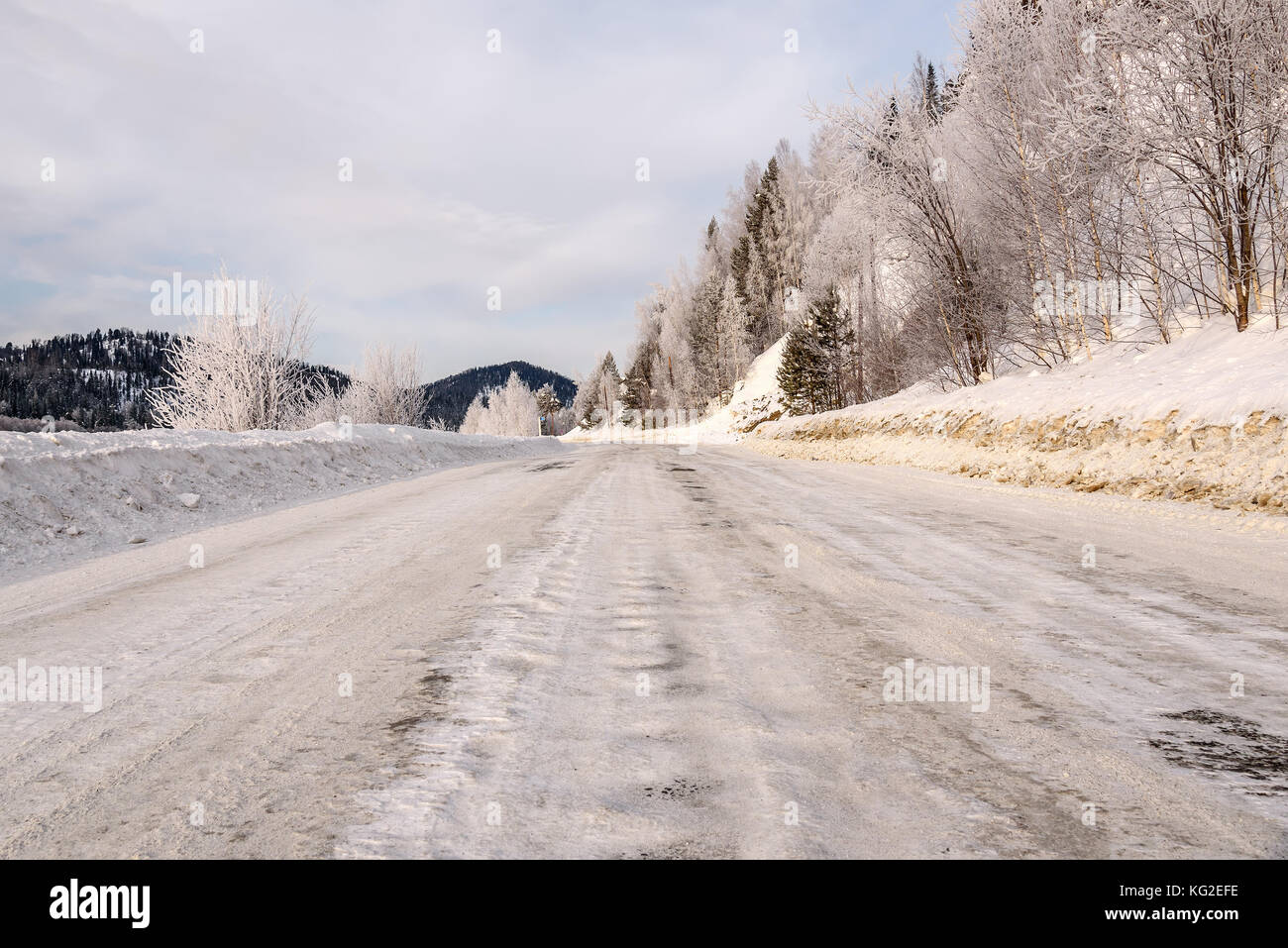 Scenic winter view from the asphalt road, covered with snow and ...