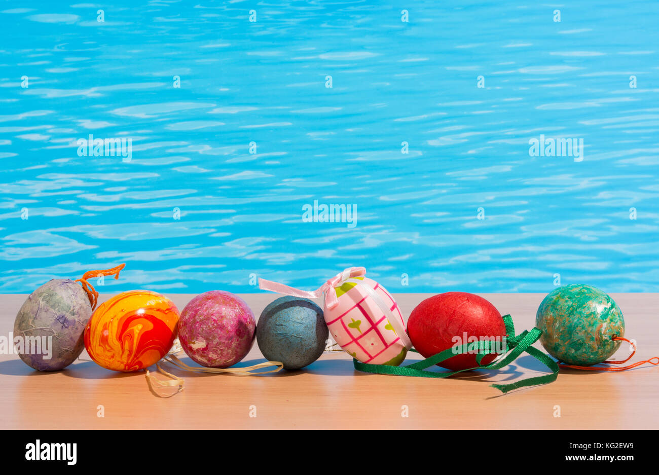 Easter in pool, wellness and relax. Eggs and water background for party ...
