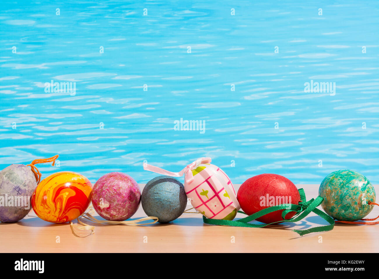 Easter in pool, wellness and relax. Eggs and water background for party ...