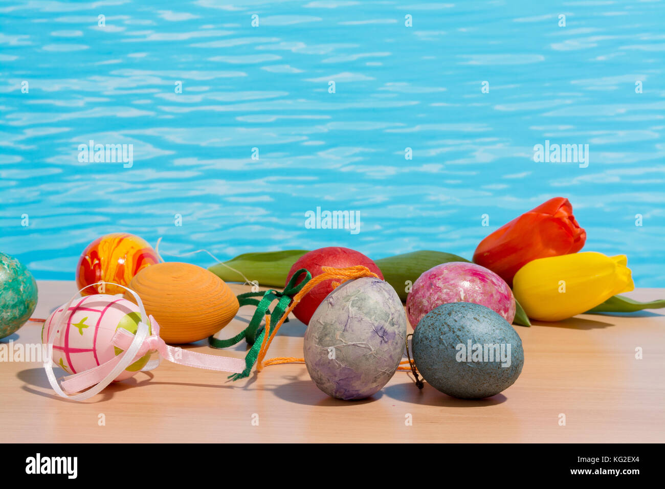 Easter in pool, wellness and relax. Eggs and water background for party ...