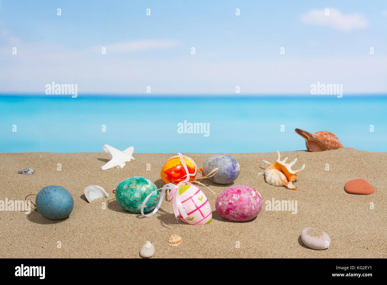 Easter on beach background. Eggs on the sandy by the ocean. Vacation ...