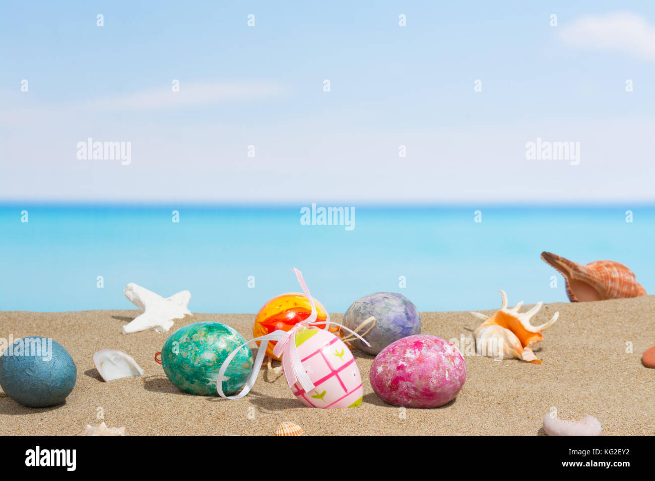 Easter on beach background. Eggs on the sandy by the ocean. Vacation ...