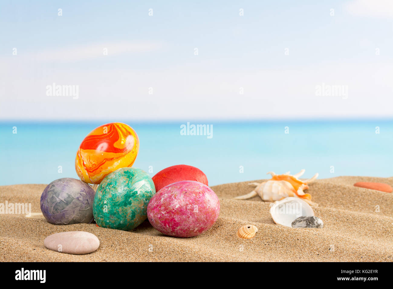 Easter on beach background. Eggs on the sandy by the ocean. Vacation ...