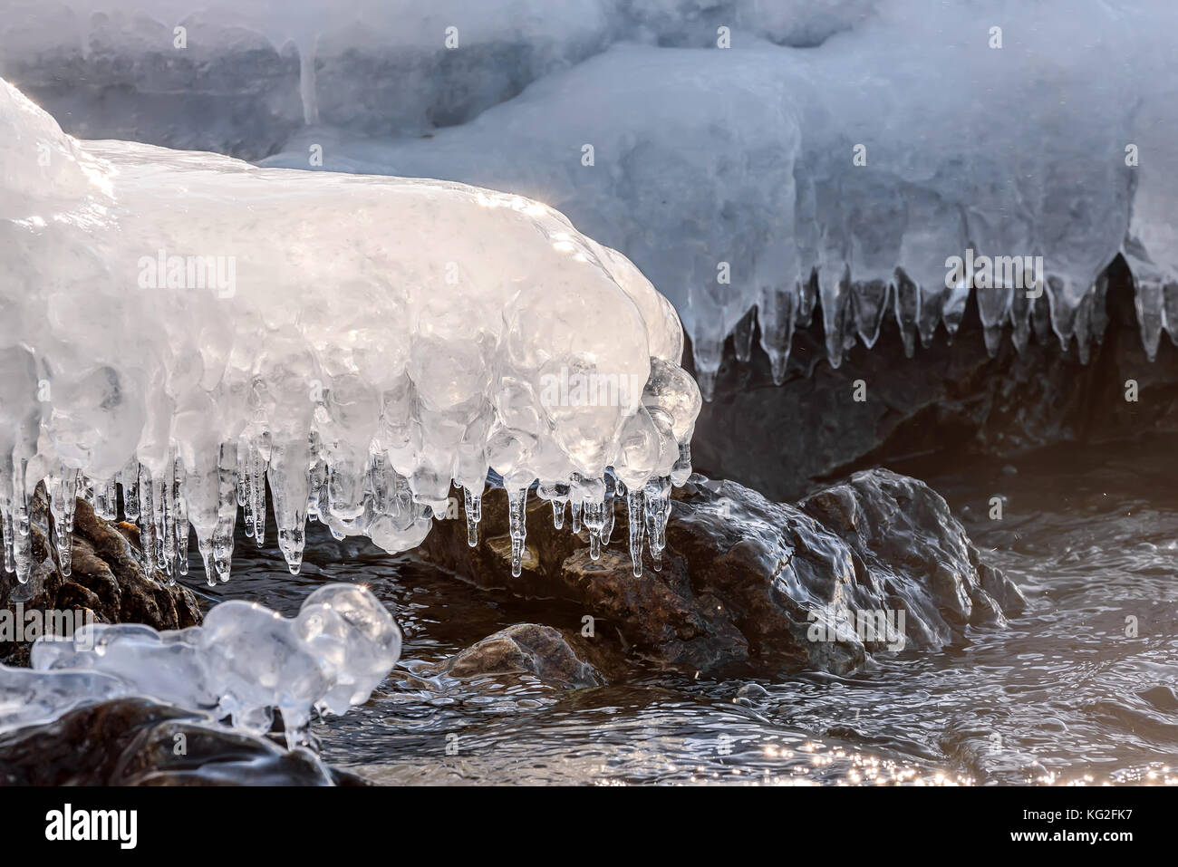 Beautiful patterns of ice, icicles of different shapes and sizes and ...
