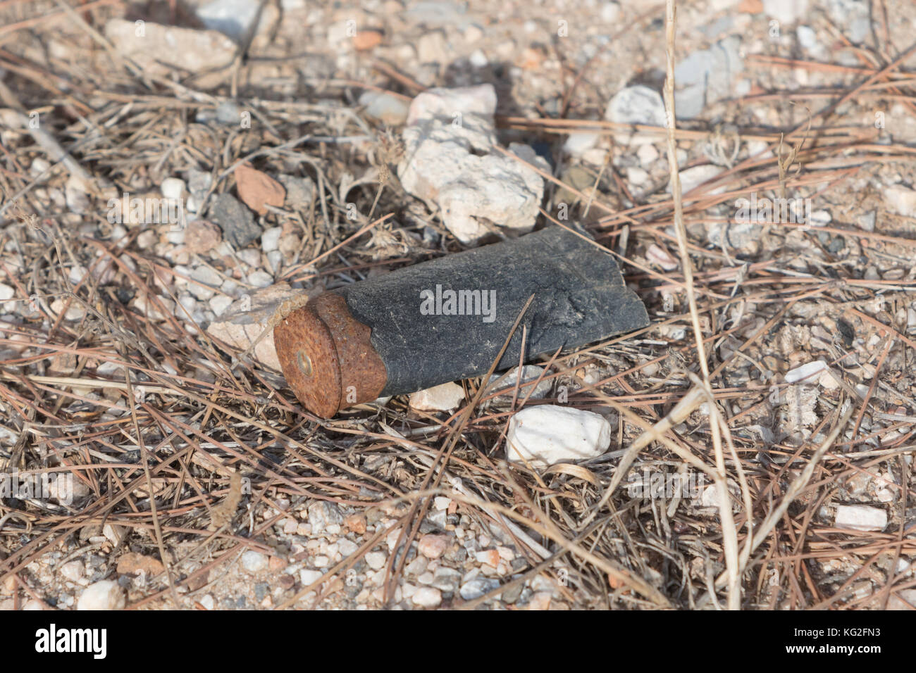 Rusty used shotgun shell on the ground Stock Photo - Alamy