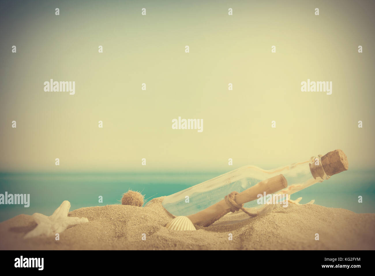 Message in bottle, on the beach in vintage style Stock Photo - Alamy