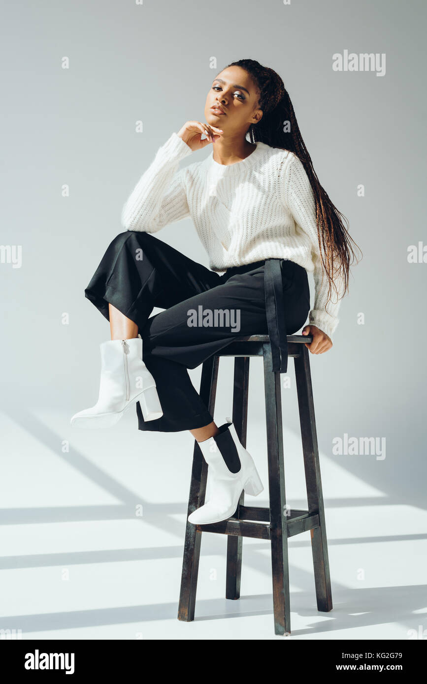 african american model posing with stool Stock Photo - Alamy