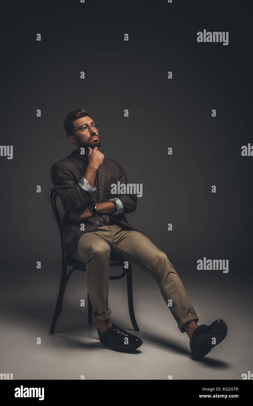 Man sitting in chair thinking hi-res stock photography and images - Alamy