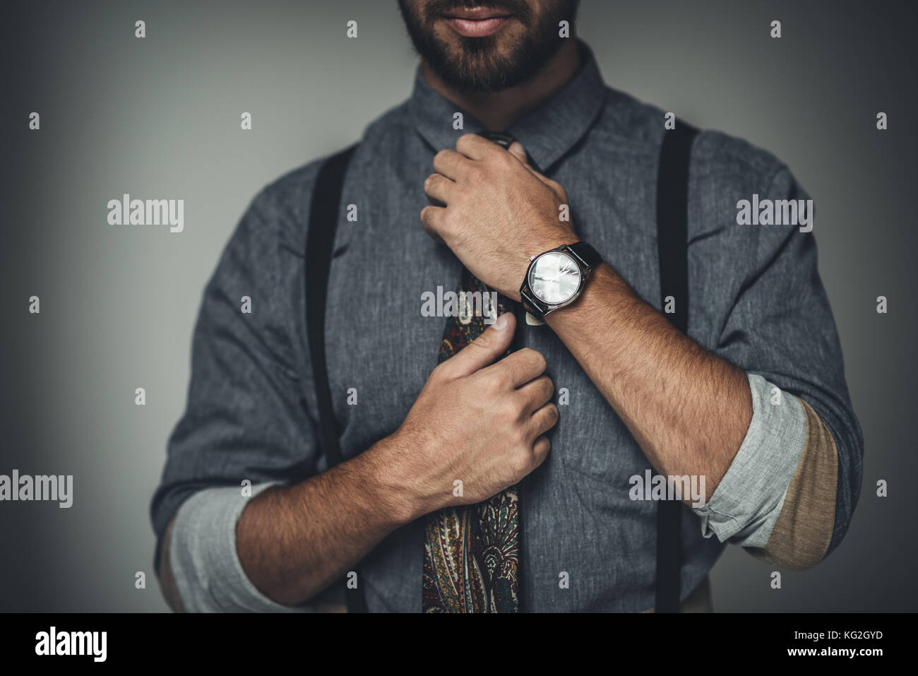 man adjusting tie Stock Photo - Alamy