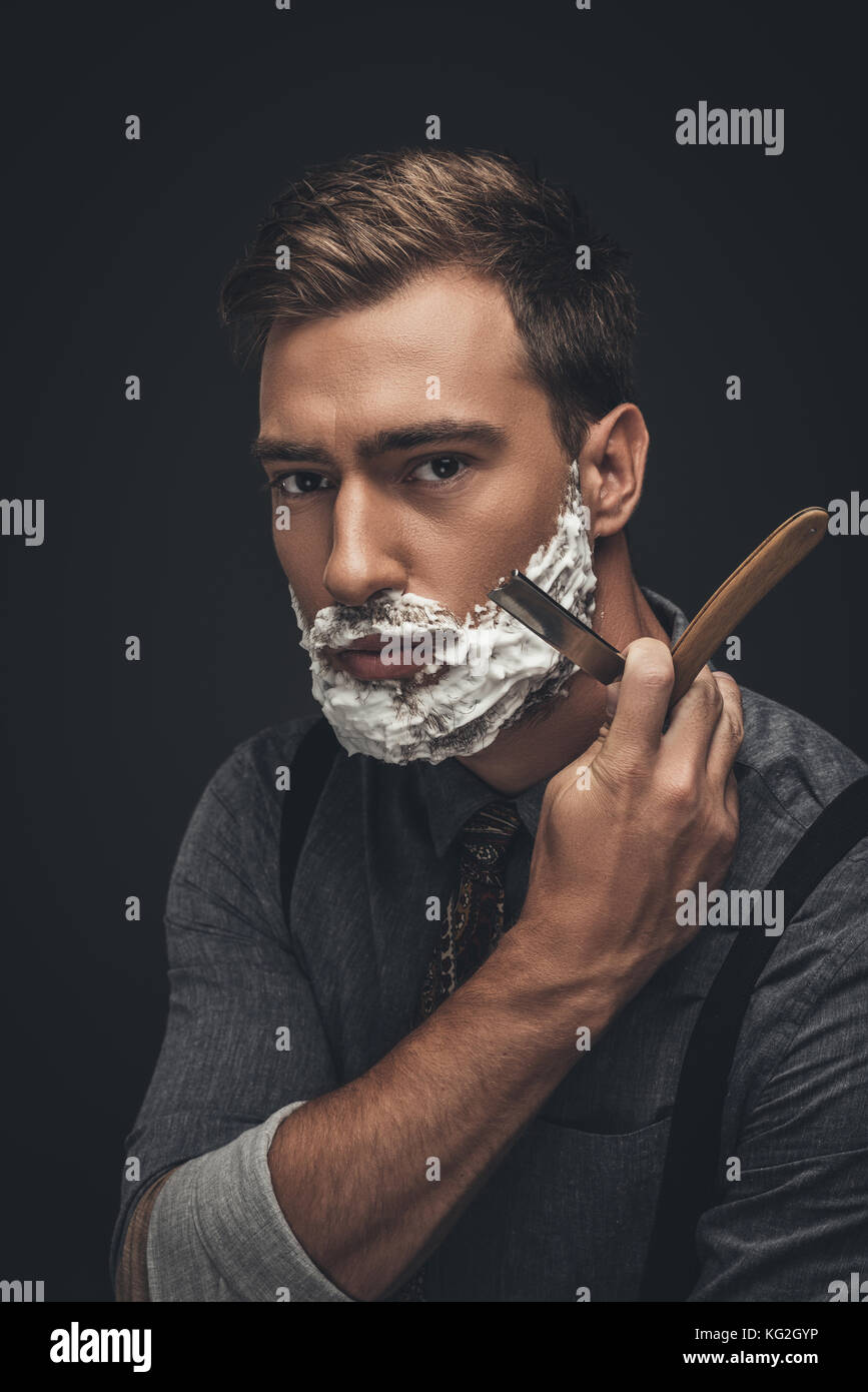 man shaving with straight razor Stock Photo - Alamy