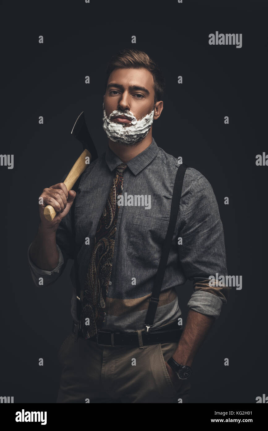 Man holding axe Stock Photo - Alamy