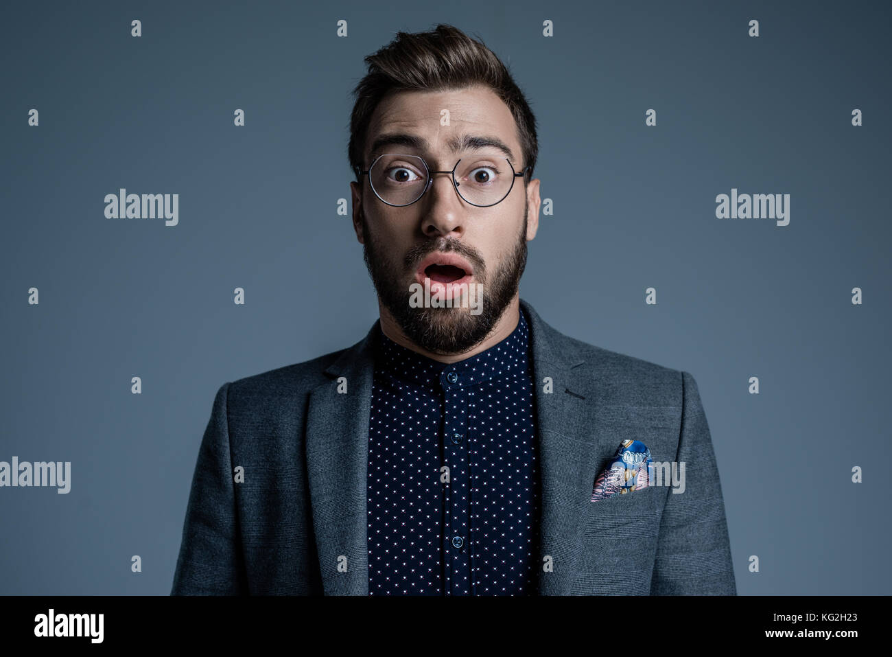 Surprised man in suit Stock Photo - Alamy