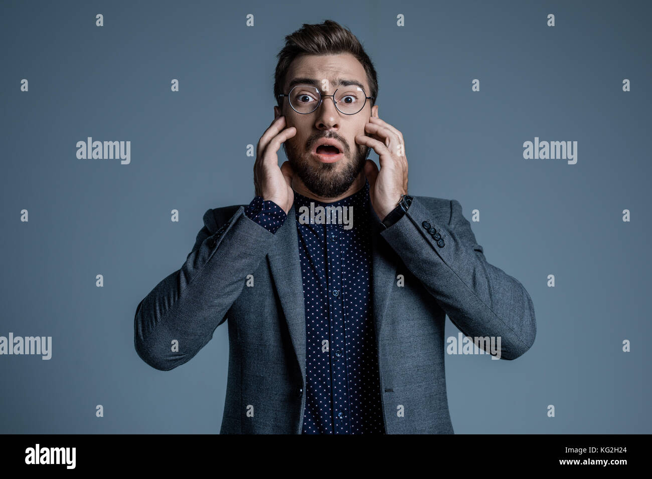Scared man in suit Stock Photo - Alamy
