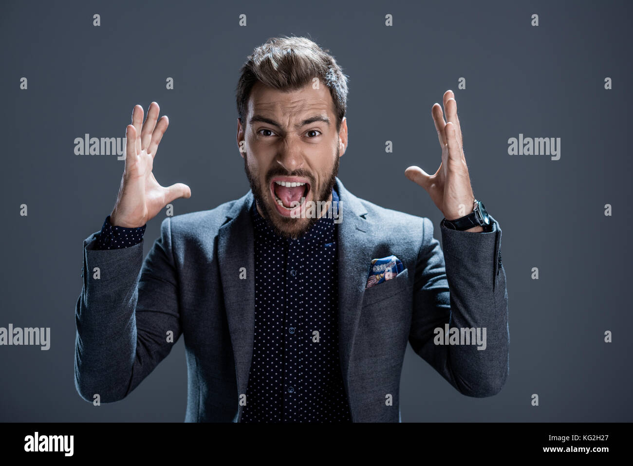 Screaming man in suit Stock Photo - Alamy