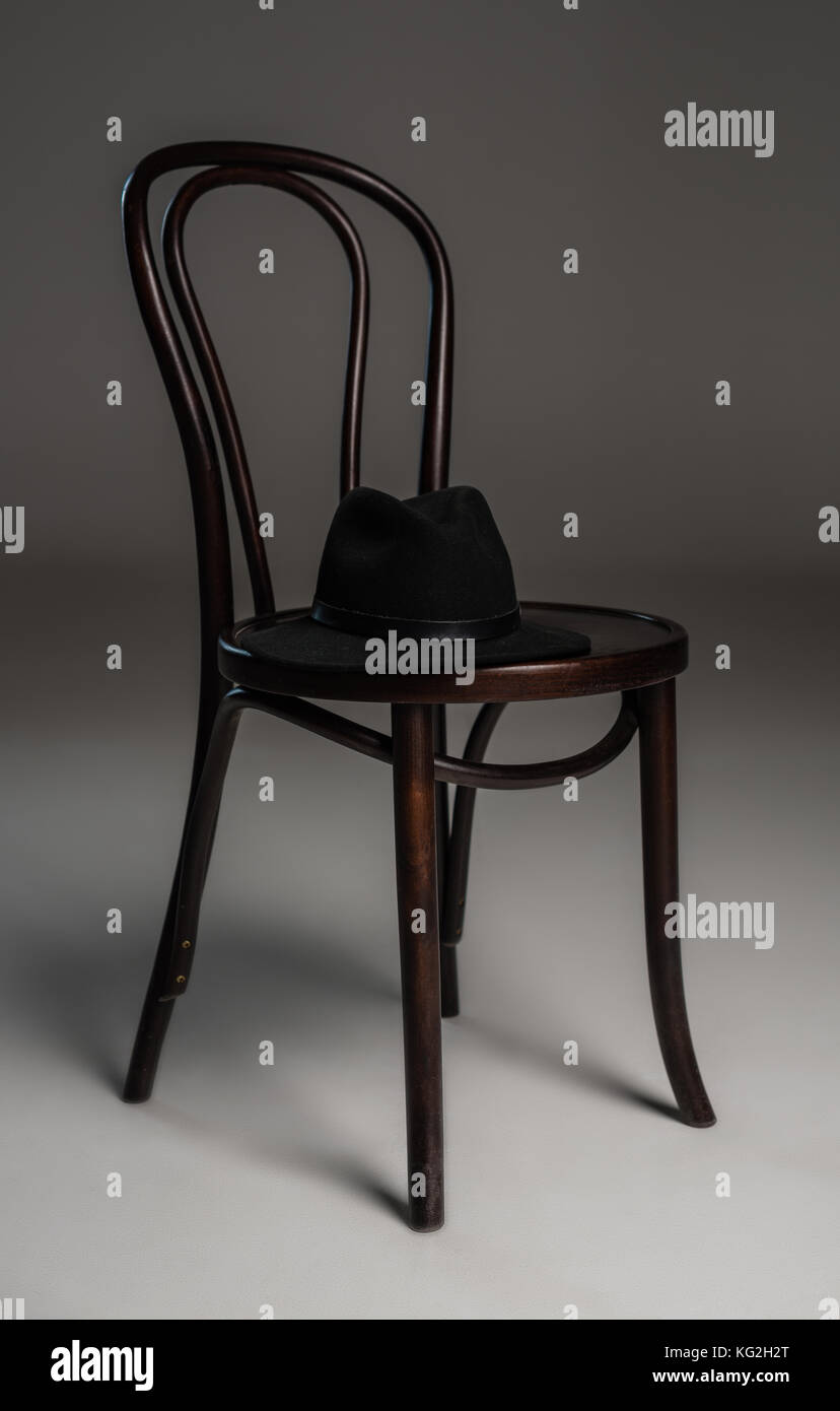 Wooden chair and hat Stock Photo - Alamy
