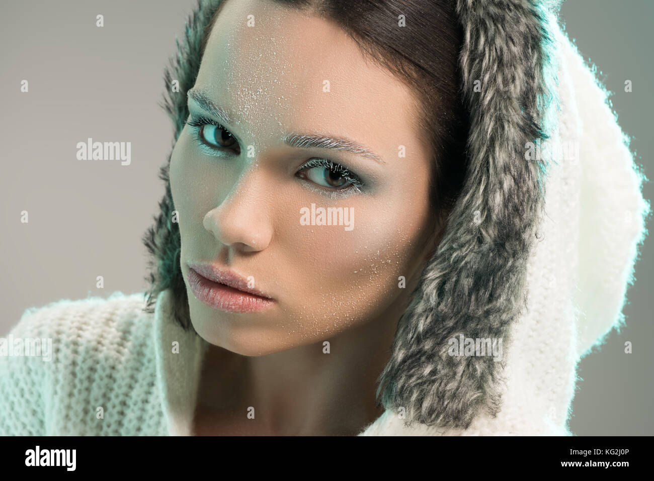 Woman in sweater with frost on face Stock Photo - Alamy
