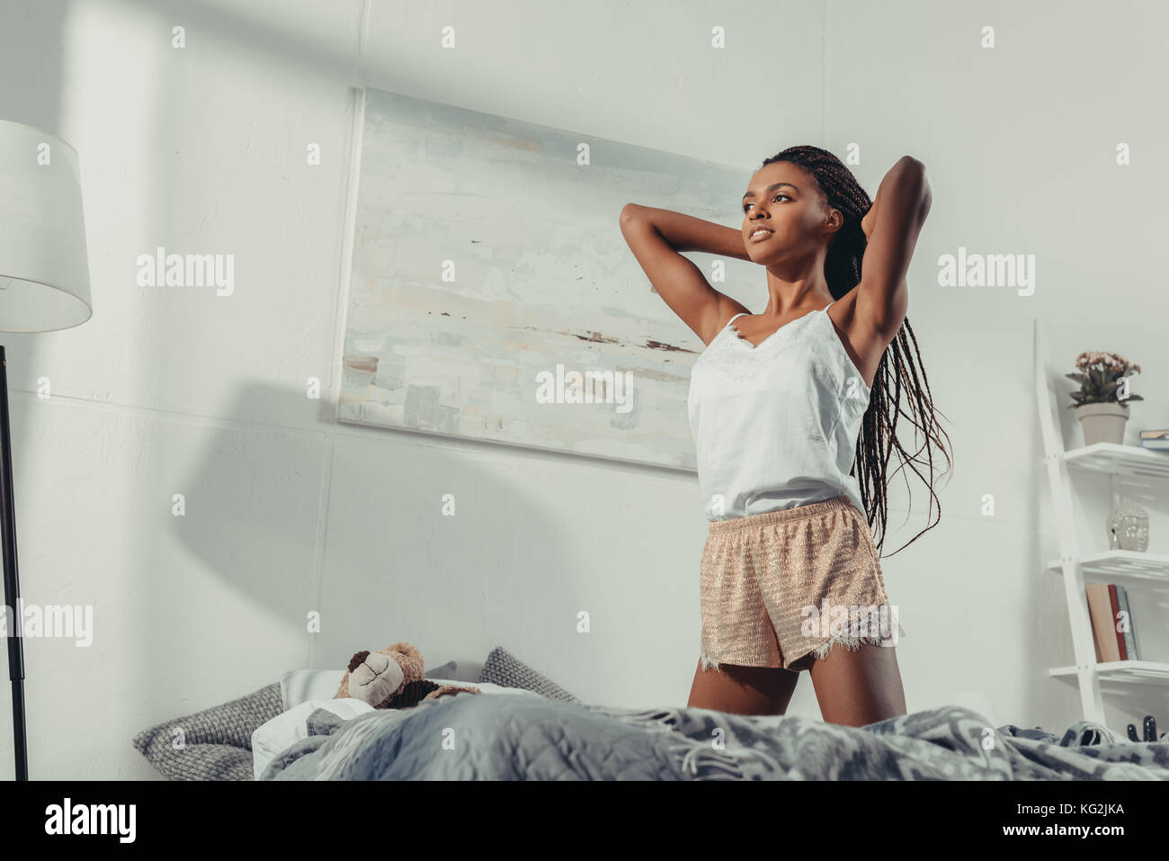 woman stretching in bed Stock Photo - Alamy