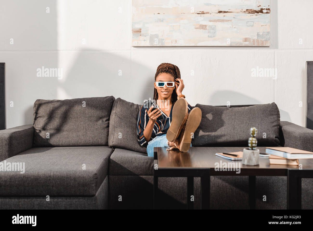 woman watching tv in 3d goggles Stock Photo - Alamy