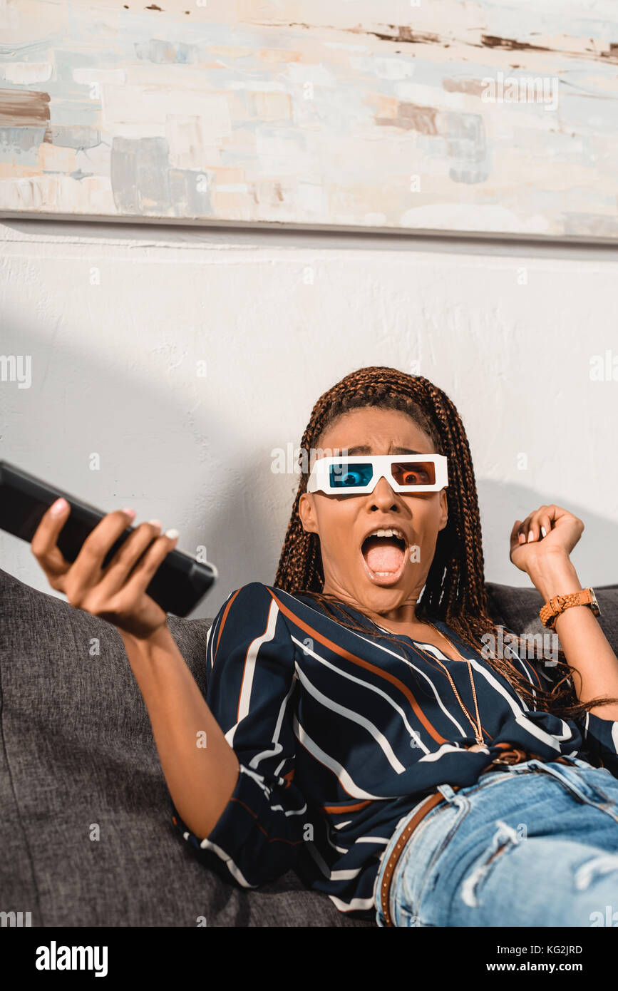woman watching tv in 3d goggles Stock Photo - Alamy