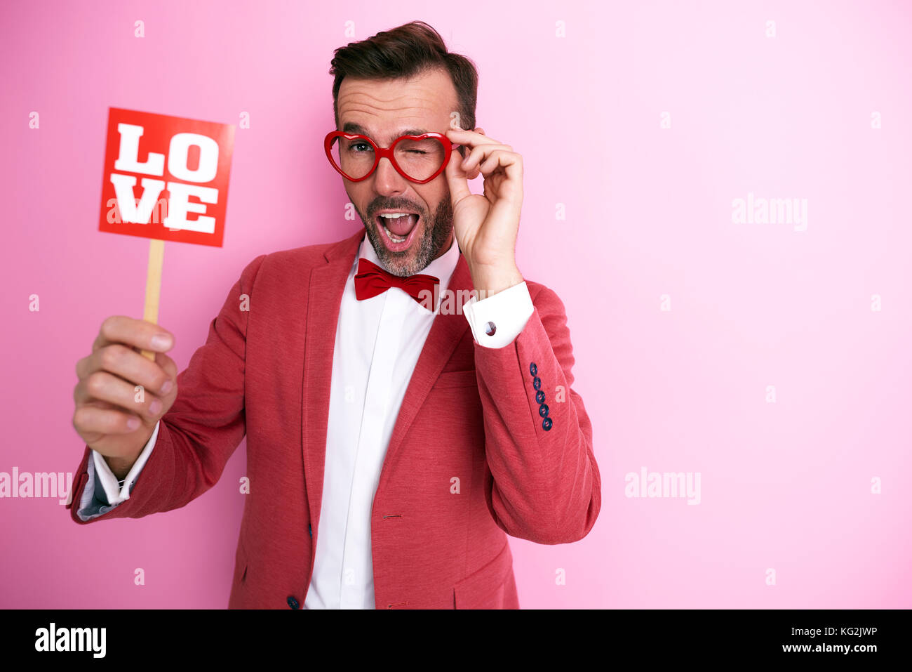 Screaming man trying valentine monocle Stock Photo - Alamy