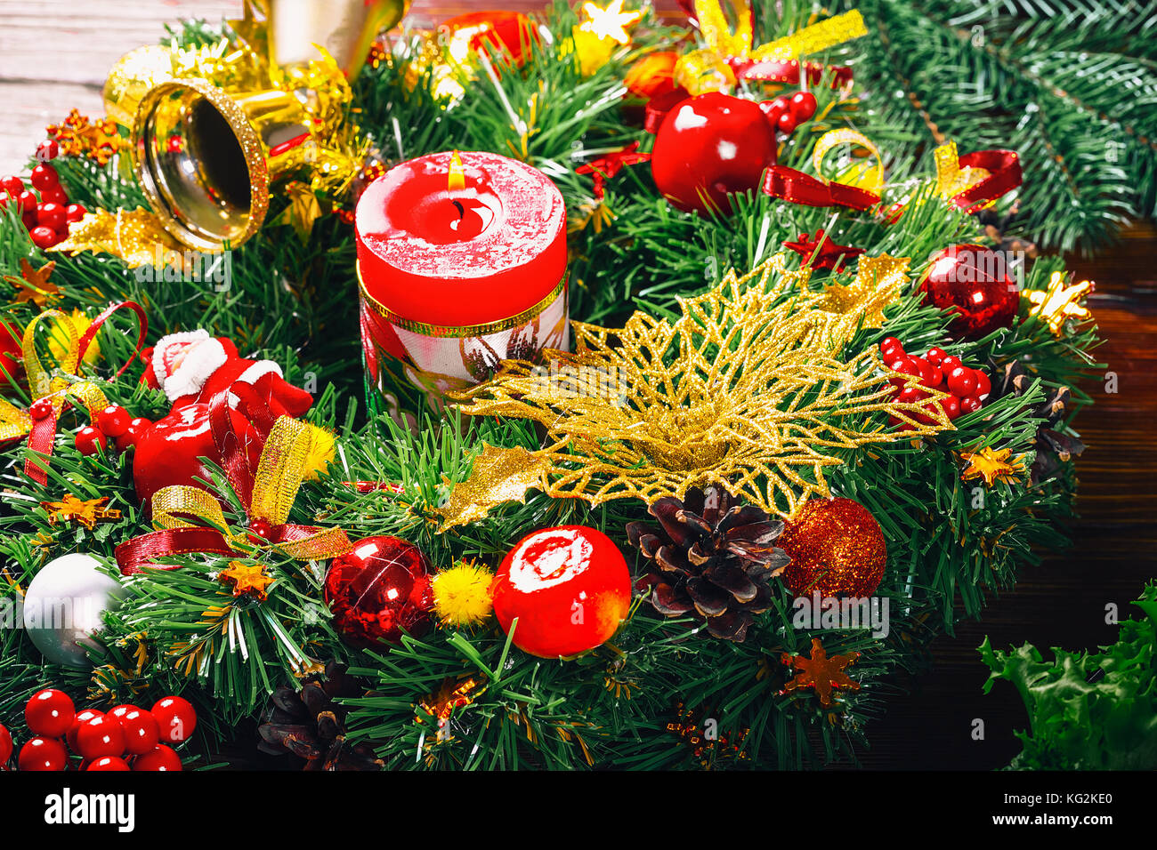 Christmas wreath with burning red candles on wooden background Stock ...