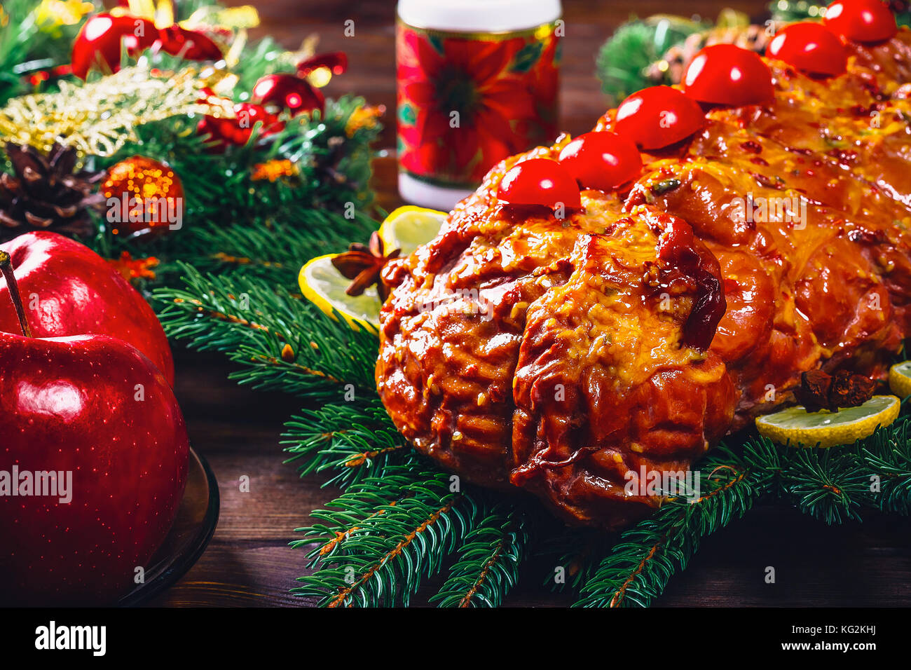 Christmas table dinner time with roasted meats, candles and New Year ...