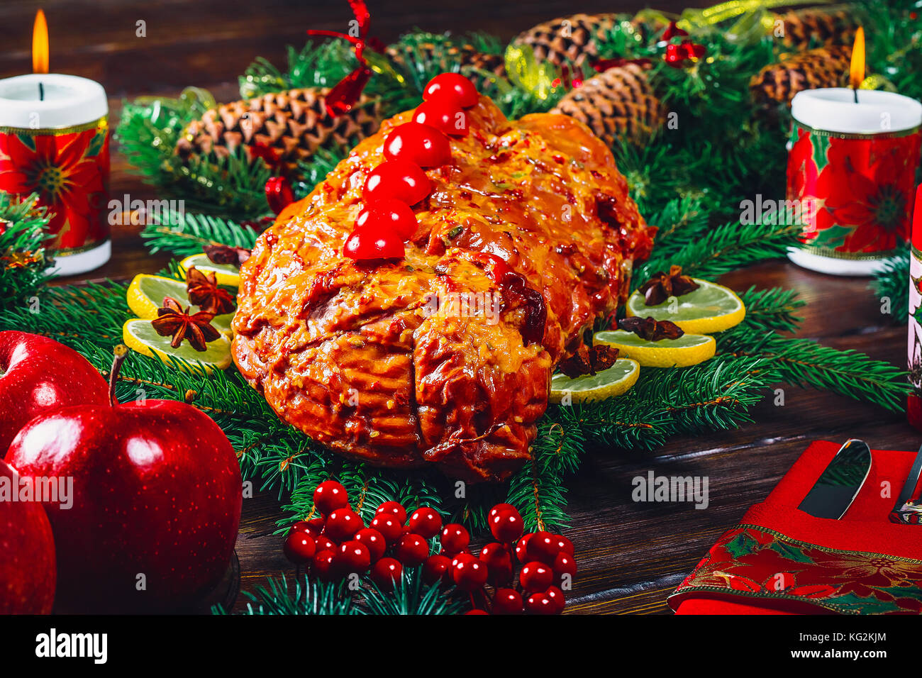 Christmas table dinner time with roasted meats, candles and New Year ...