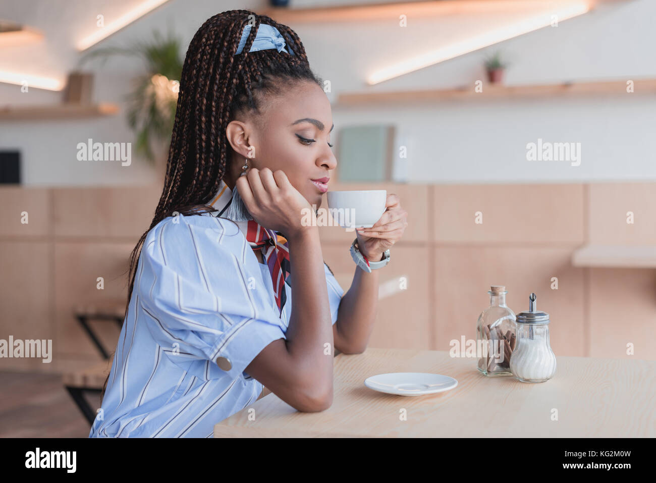 african american woman drinking coffee in cafe Stock Photo - Alamy