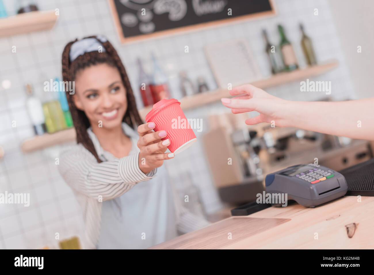 barista giving customer coffee Stock Photo - Alamy